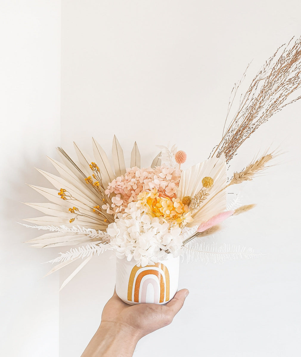 Rainbow beach pot arrangement with warm girly colours. – Beach to Bloom